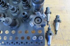 Machines Used | (14) Assorted Cat 40 Tool Holders with Huot Rack