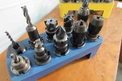 Machines Used | (10) Assorted Cat 40 Tool Holders with Rack