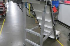 Machines Used | QC Conveyors 19-1/2" Wide Lift Up Paddle Type Belt Conveyor