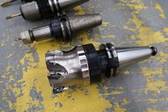 Machines Used | Cat 40 Tool Holders: (3) Tapping Heads, (2) 3" Shell Mills, (1) ER16 Collet