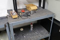 Machines Used | (2) Metal Tables with Misc Contents