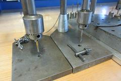 Machines Used | 3 Small Hand Tapping Stations, 2 with Chucks