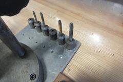 Machines Used | 3 Small Hand Tapping Stations, 2 with Chucks