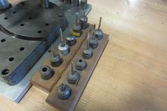 Machines Used | 3 Small Hand Tapping Stations, 2 with Chucks