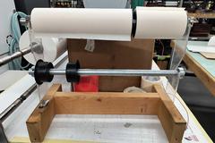 Machines Used | Metal Bench with Contents of Roll Dispensers and Material